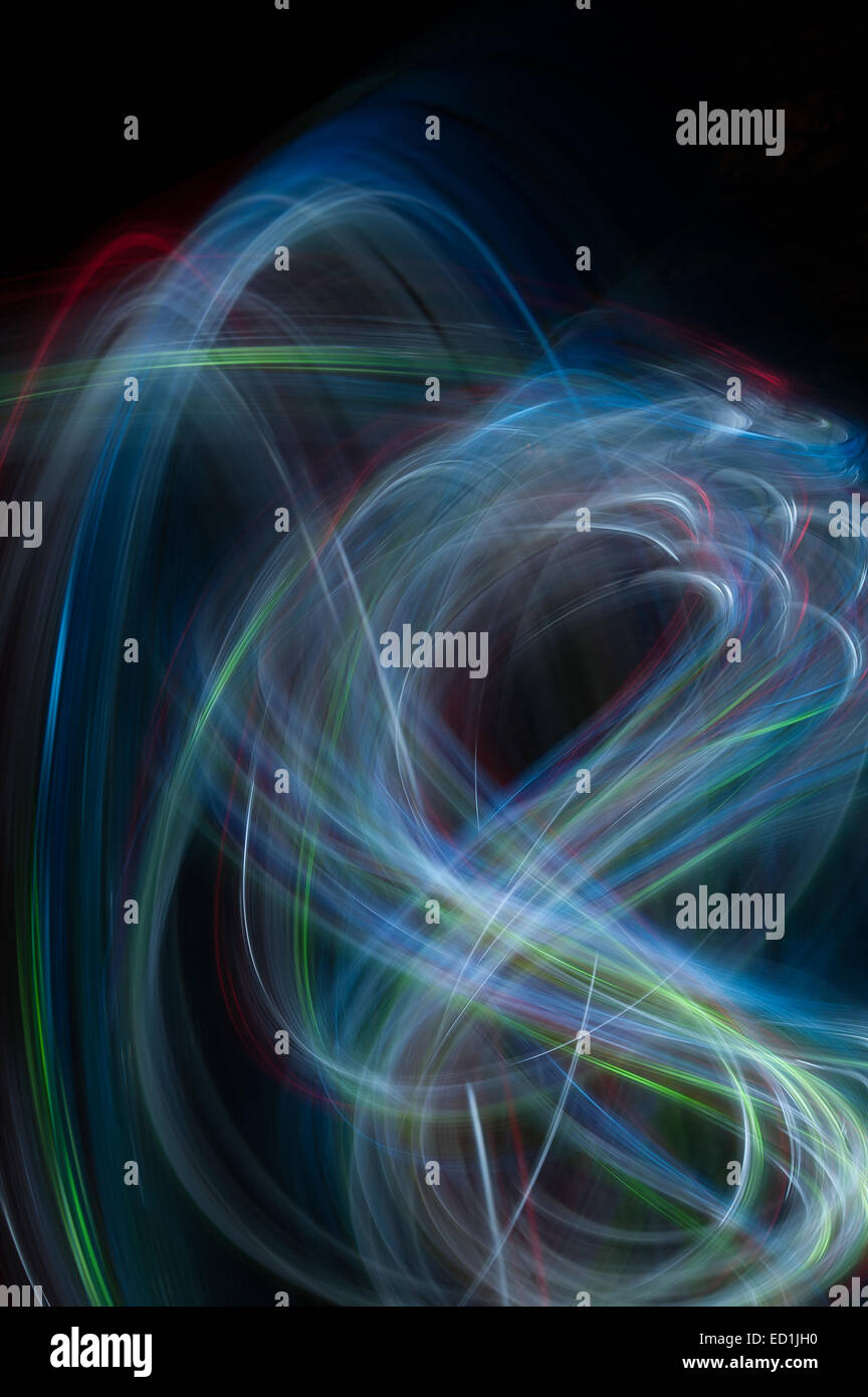 swirling spinning motion and trails traces of moving lights creating ...