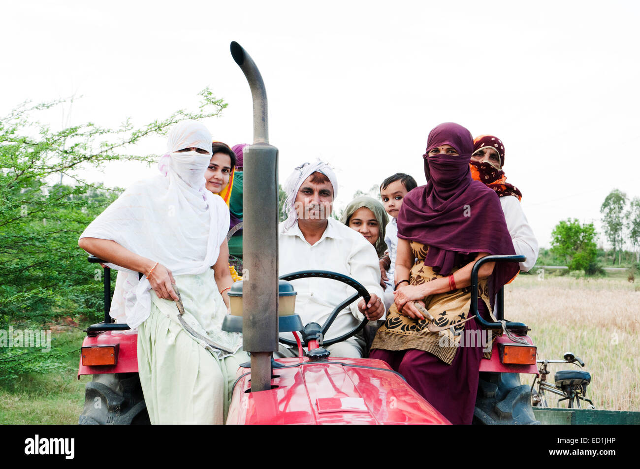 indian Farmer Family riding Tractor Stock Photo - Alamy