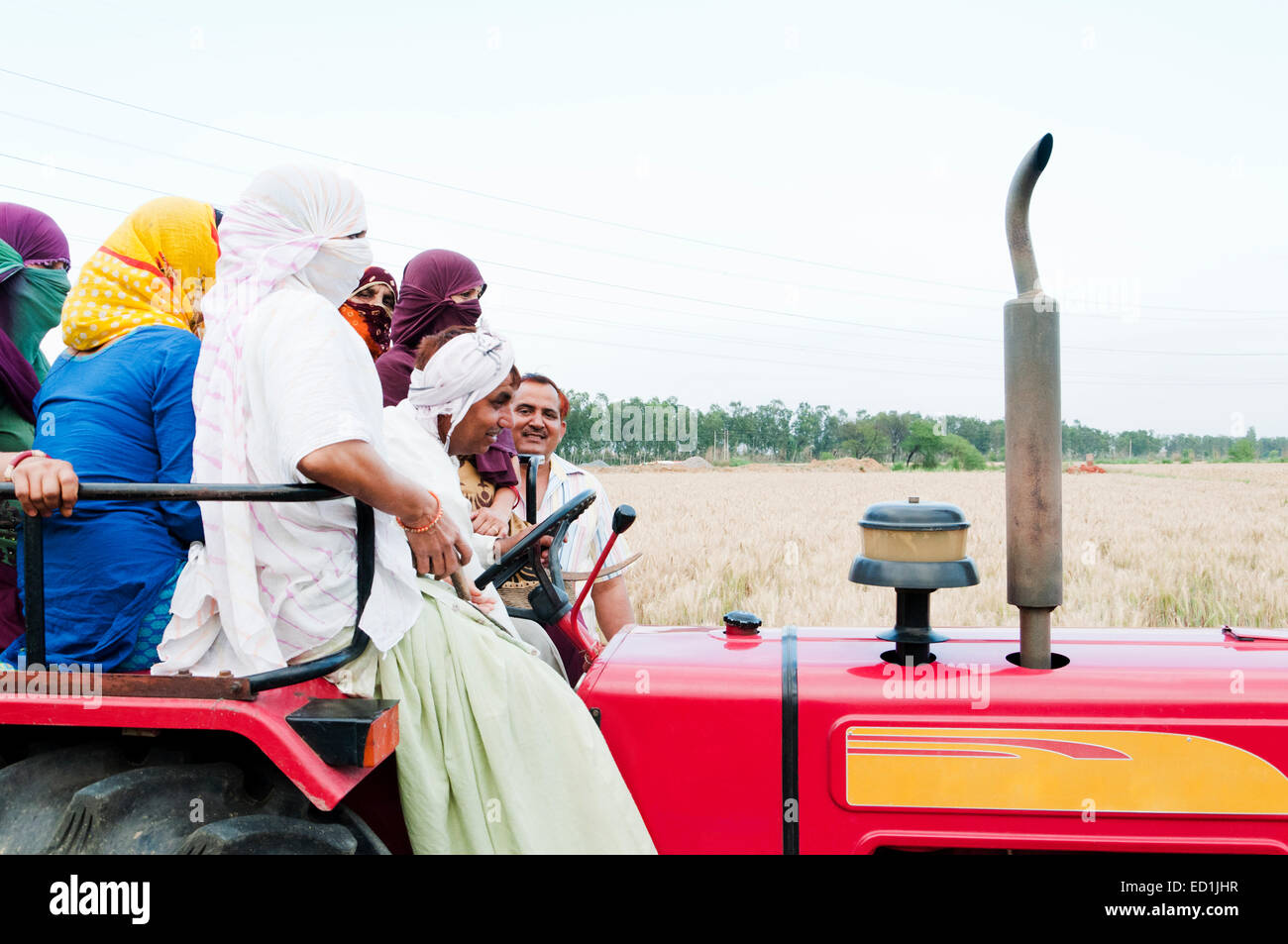 indian Farmer Family riding Tractor Stock Photo - Alamy