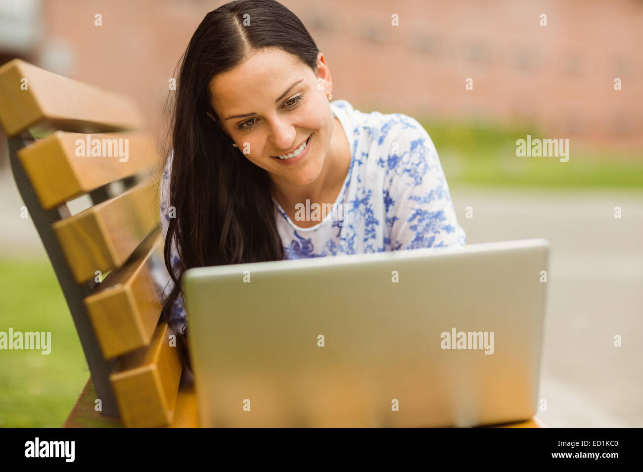 Young woman lying on bench using hi-res stock photography and images ...