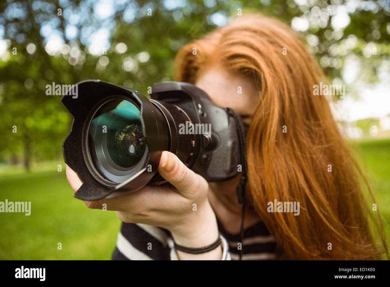 Female photographer at park Stock Photo - Alamy