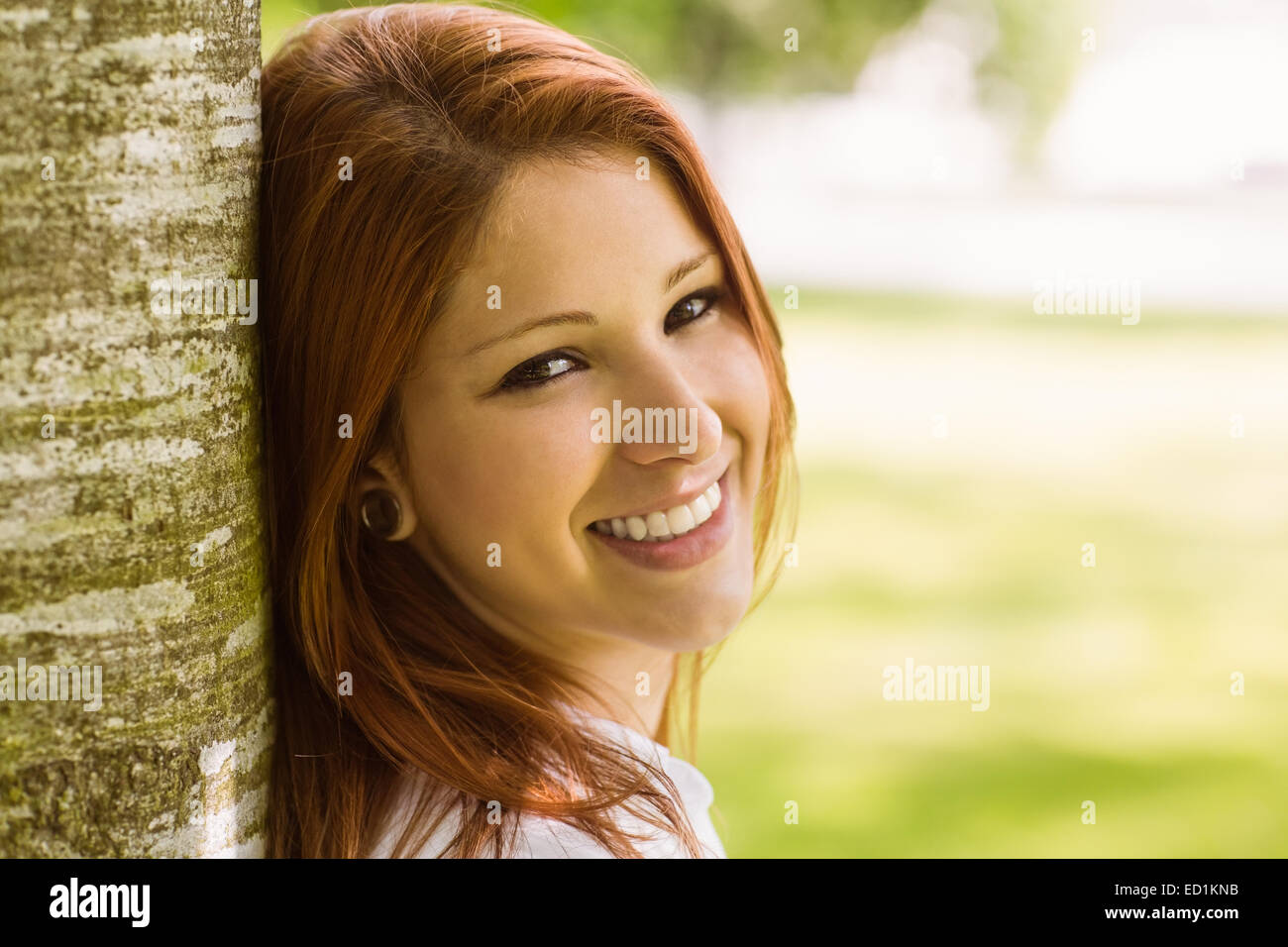 Portrait of a pretty redhead smiling Stock Photo - Alamy