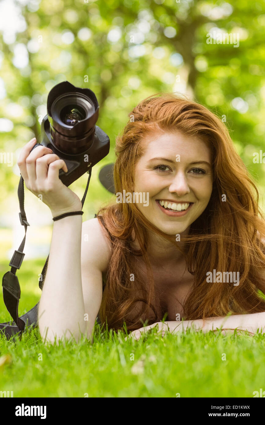 Beautiful female photographer at park Stock Photo - Alamy