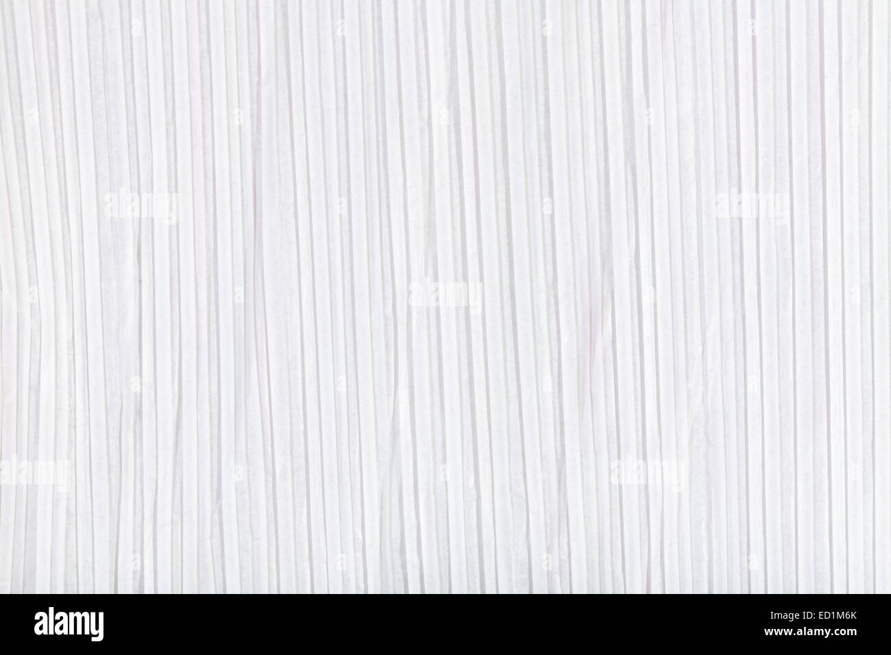 background from sheet of white light colored corrugated paper close up ...