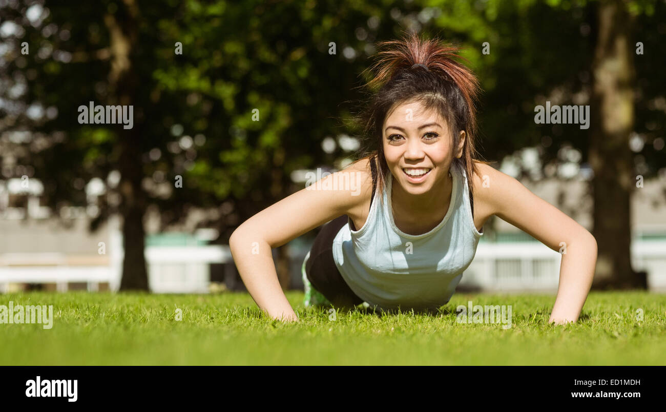 Woman doing push ups in the park hi-res stock photography and images ...
