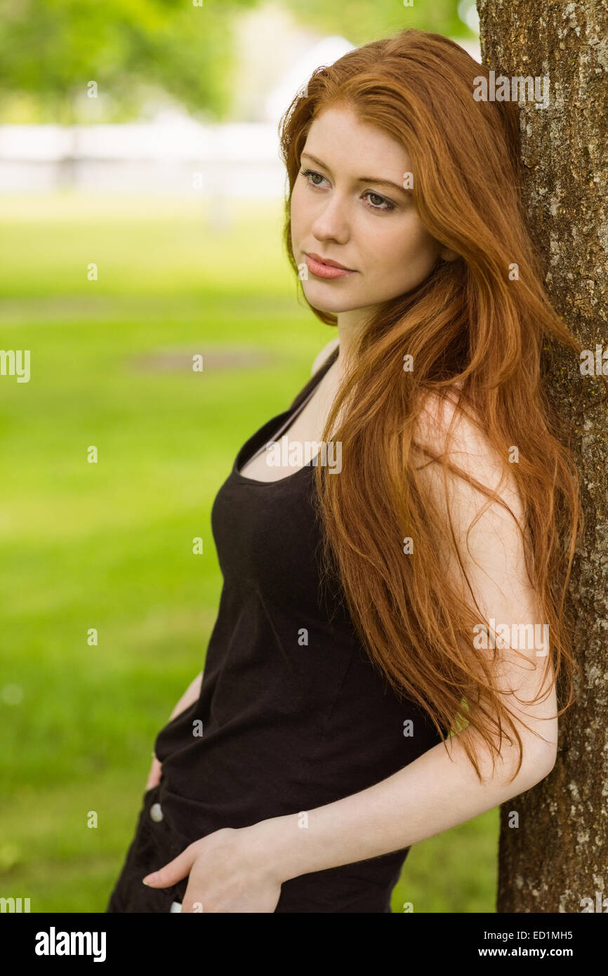 Side view of beautiful woman in park Stock Photo - Alamy
