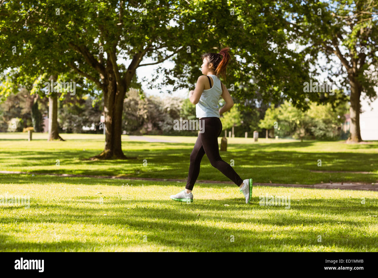 Woman exercising outdoors in beautiful hi-res stock photography and ...