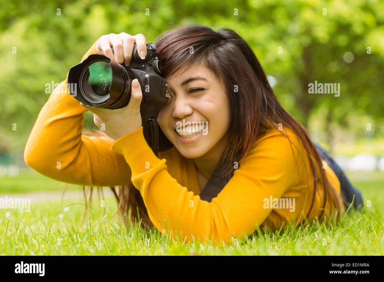 Female photographer at park Stock Photo - Alamy