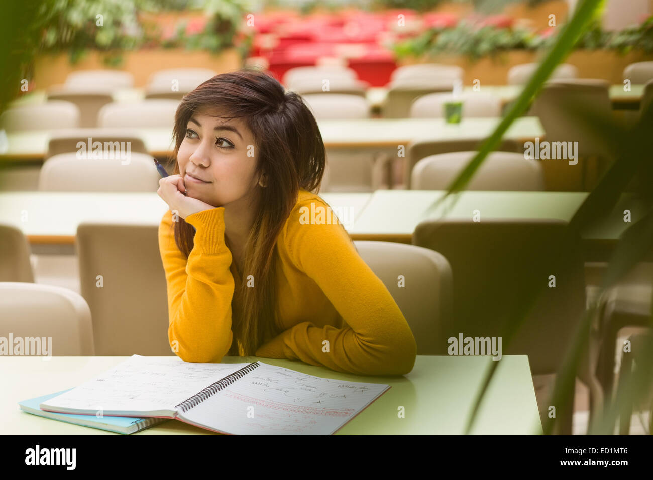 College student doing homework in canteen Stock Photo - Alamy