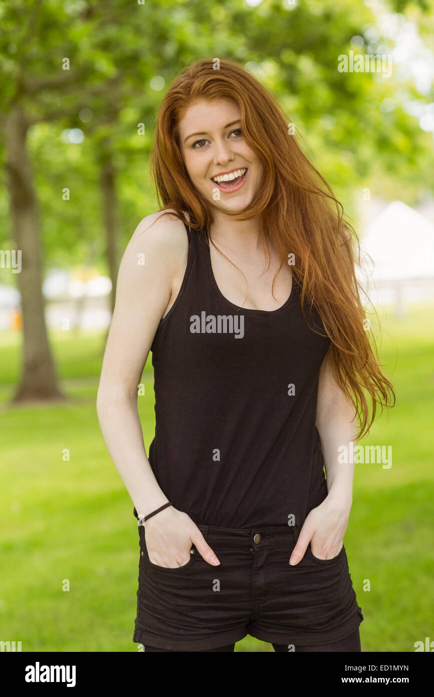 Portrait of beautiful woman in park Stock Photo - Alamy