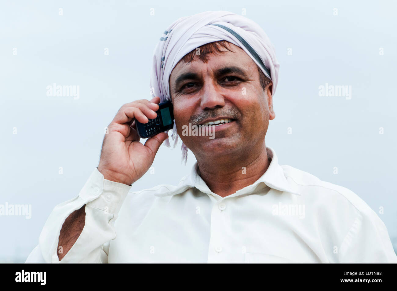 Indian male 50s phone hi-res stock photography and images - Alamy