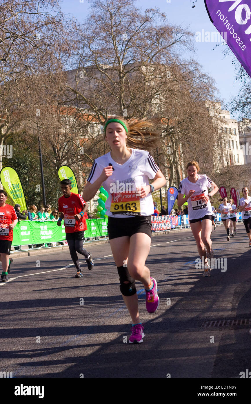 LONDON - APRIL 13: Unidentified girls run the London marathon on April ...