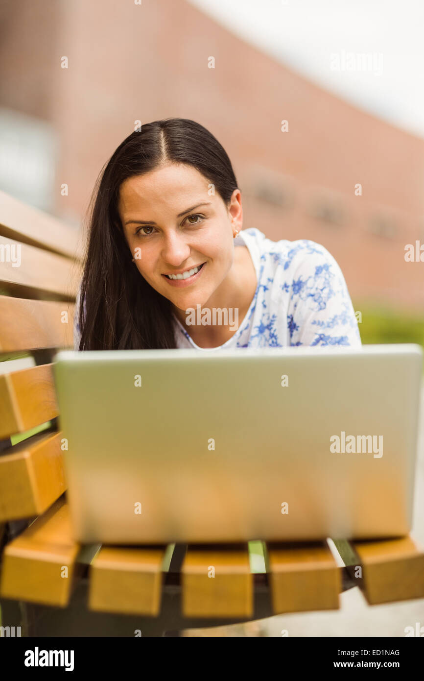 Young woman lying on bench using hi-res stock photography and images ...