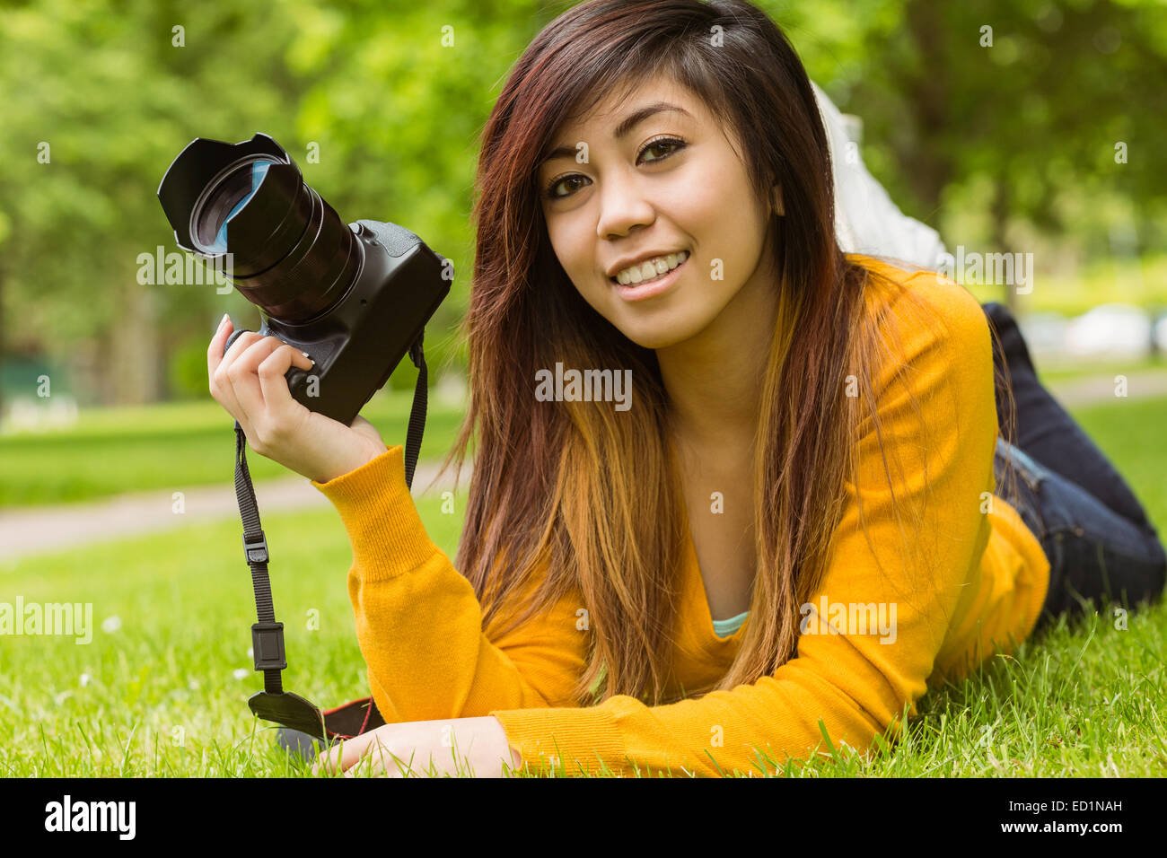 Female photographer at park Stock Photo - Alamy