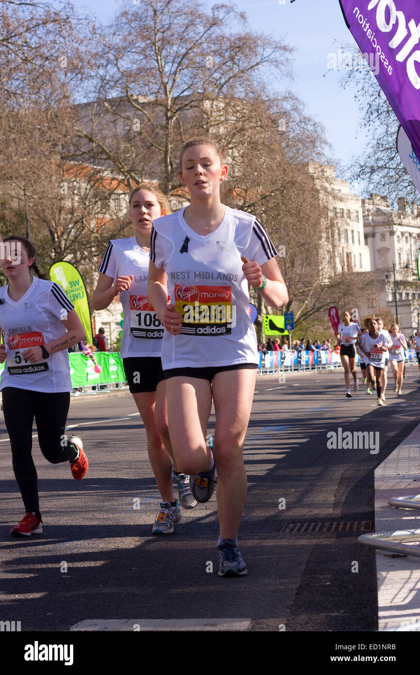 LONDON - APRIL 13: Unidentified girls run the London marathon on April ...