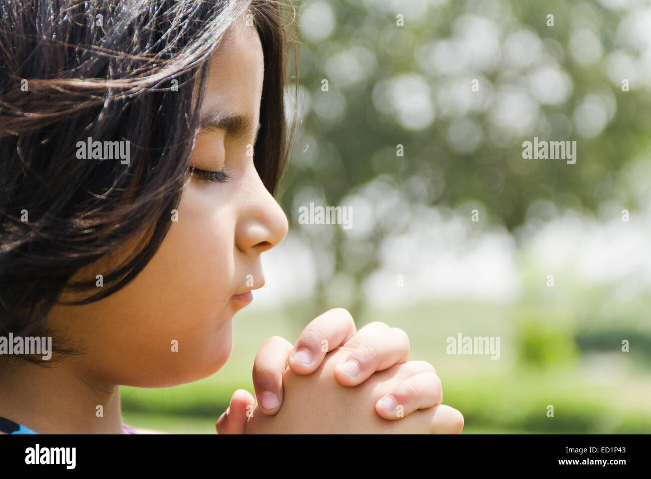 Girl praying outside hi-res stock photography and images - Alamy