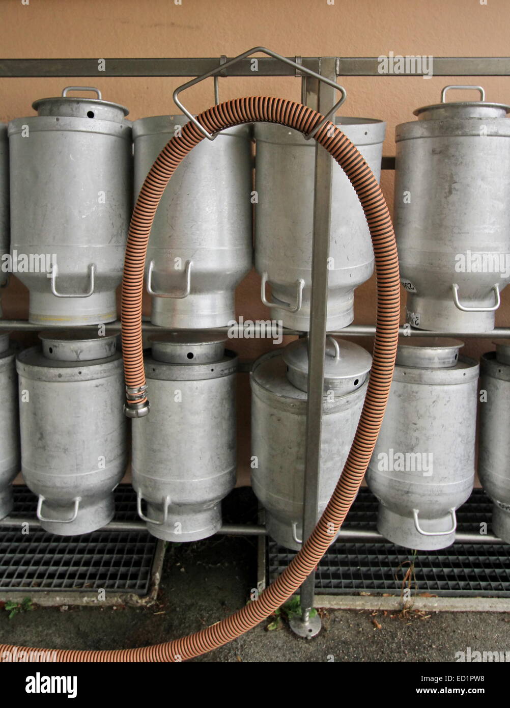 Several milk churns in a row at the dairy Stock Photo - Alamy