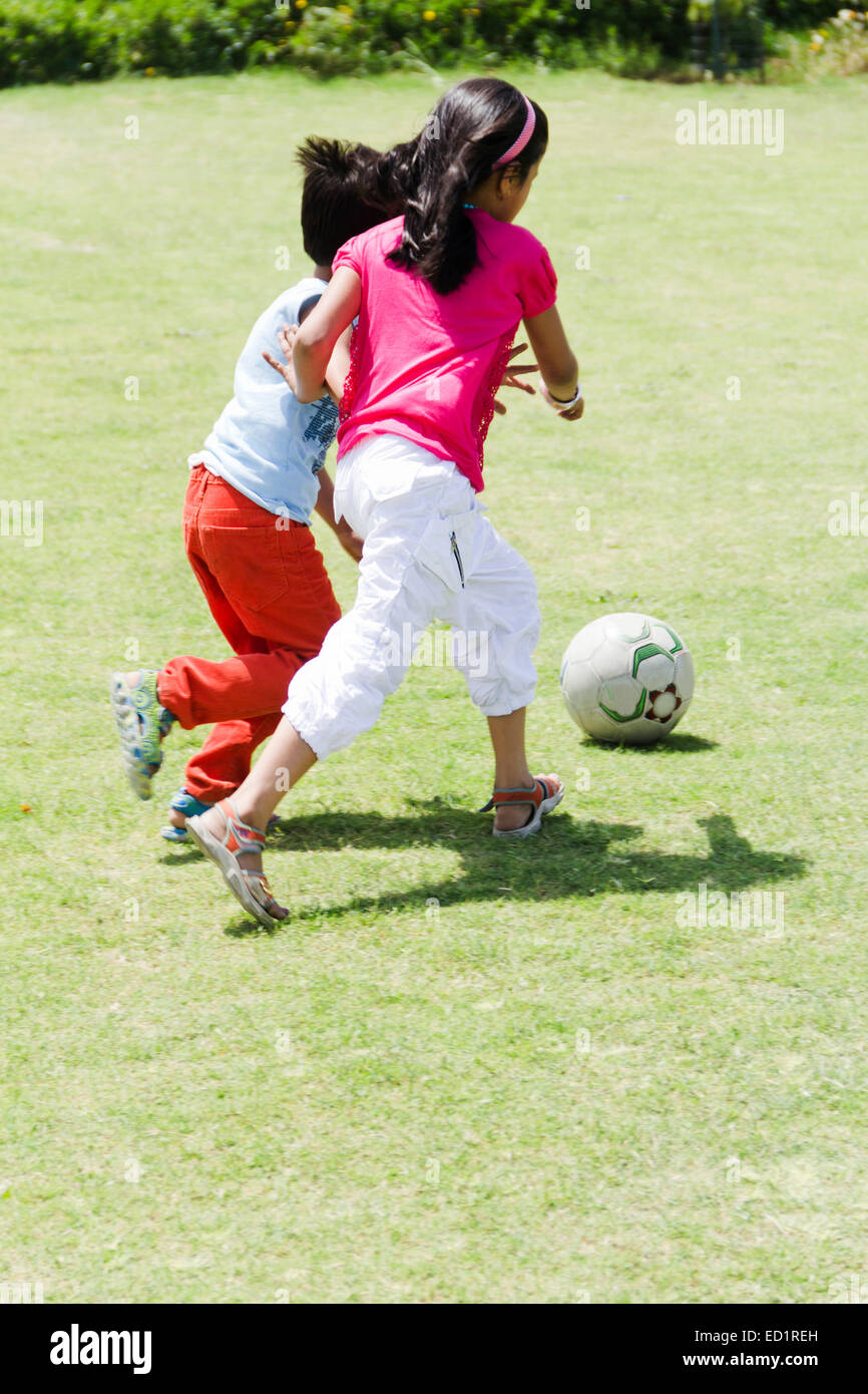 2 indians child friend park playing Football Stock Photo - Alamy