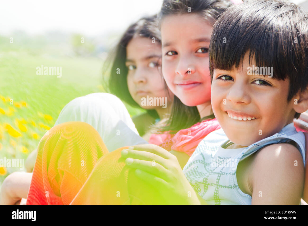 indians children sitting park enjoy Stock Photo - Alamy