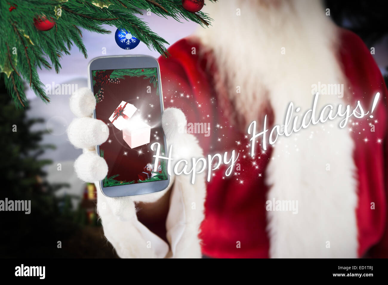 Composite image of santa claus showing smartphone Stock Photo - Alamy