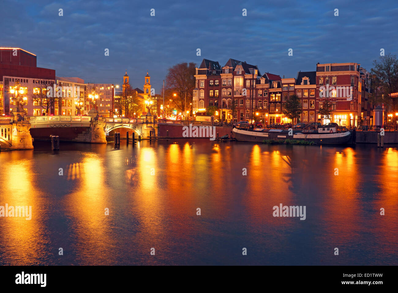 City scenic from Amsterdam in the Netherlands by night Stock Photo - Alamy