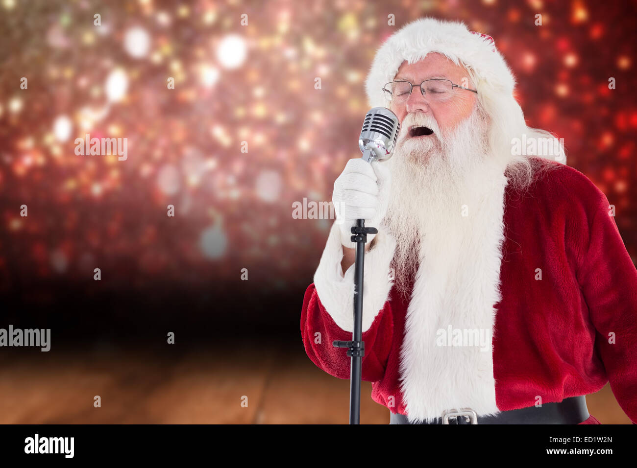 Composite image of santa sings like a superstar Stock Photo - Alamy