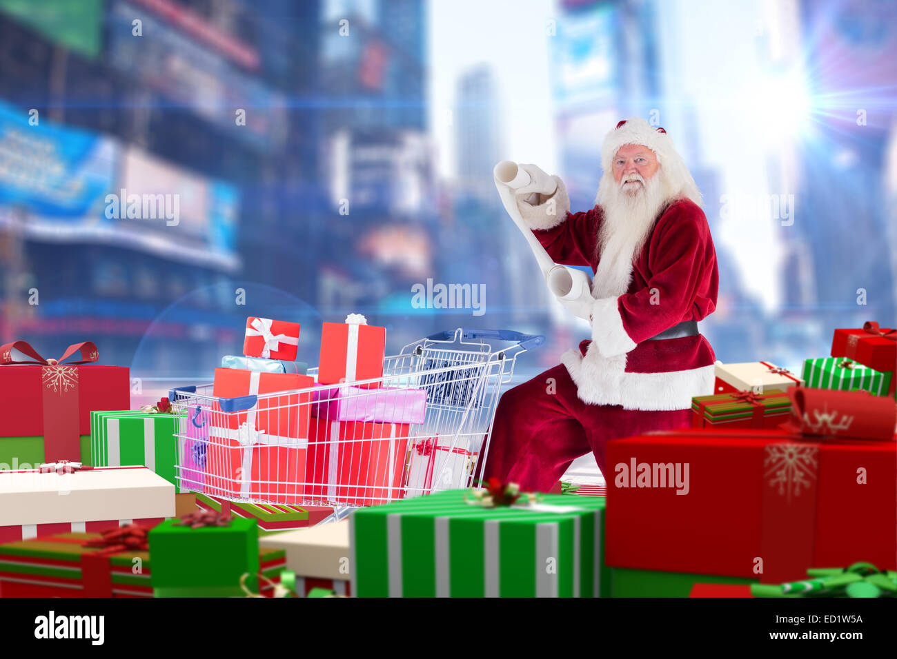 Composite image of santa delivering gifts from cart Stock Photo - Alamy