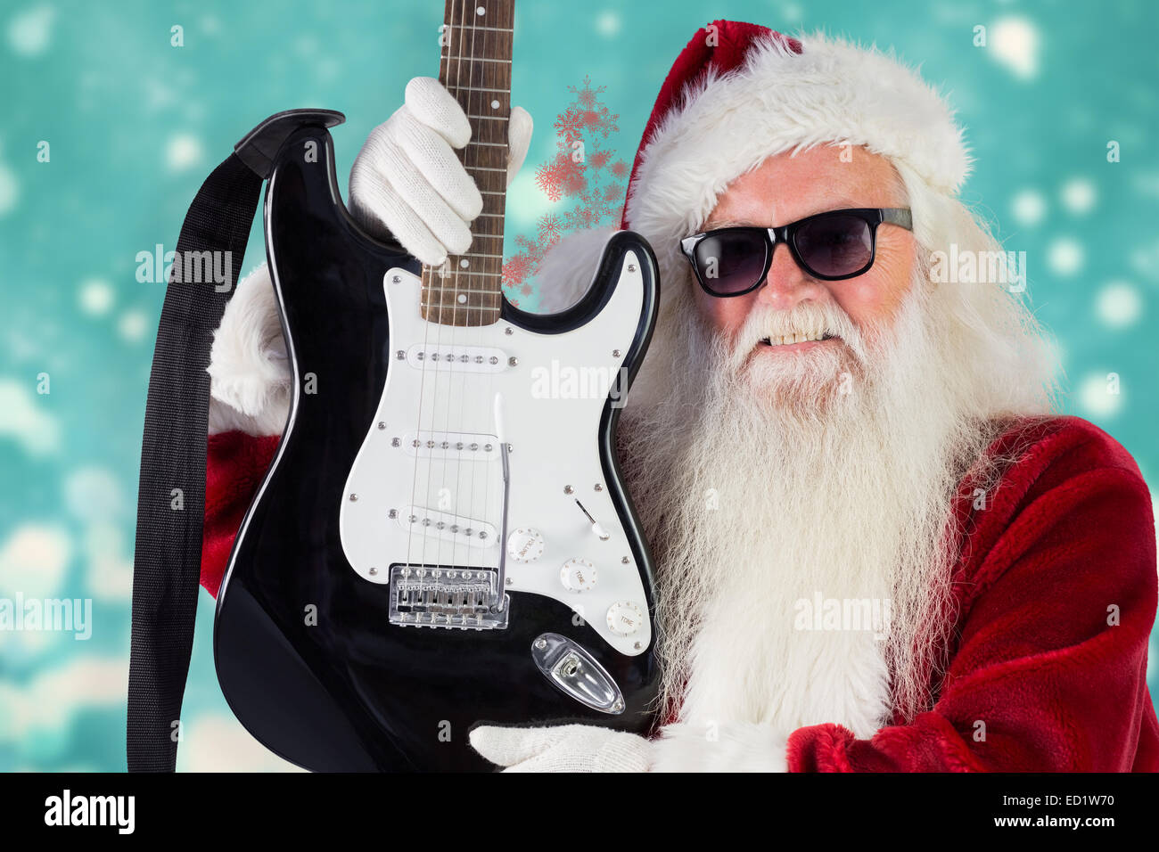 Composite image of father christmas shows a guitar Stock Photo - Alamy