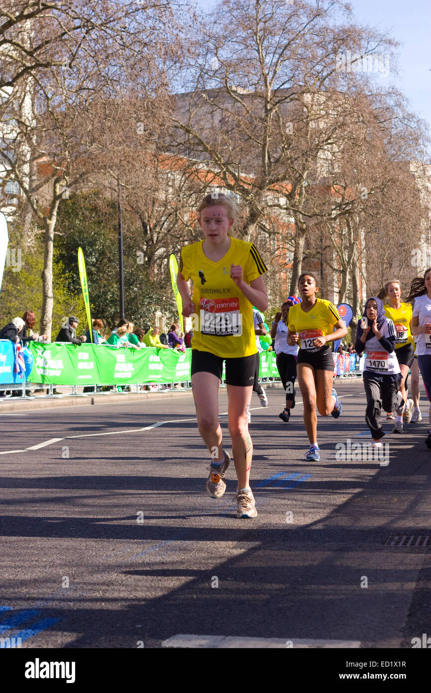 LONDON - APRIL 13: Unidentified girls run the London marathon on April ...