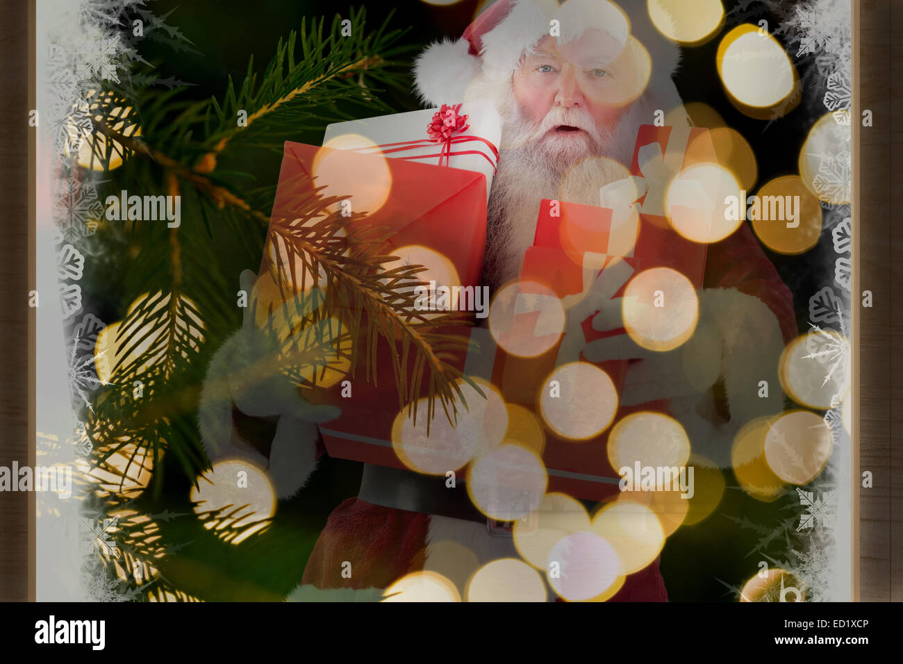 Composite image of santa carries a few presents Stock Photo - Alamy