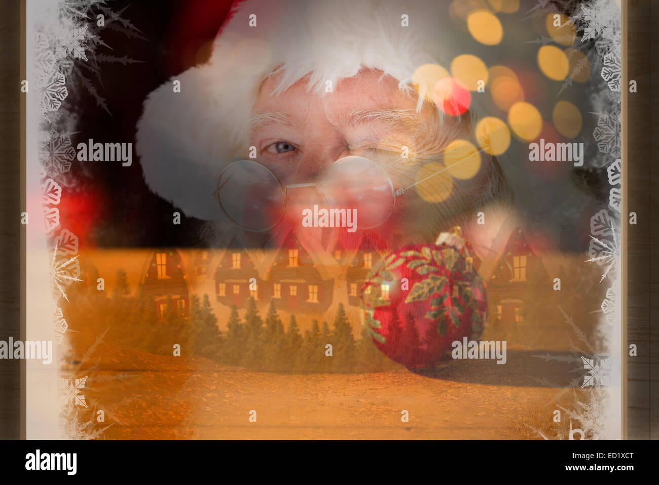 Composite image of santa claus winking Stock Photo - Alamy