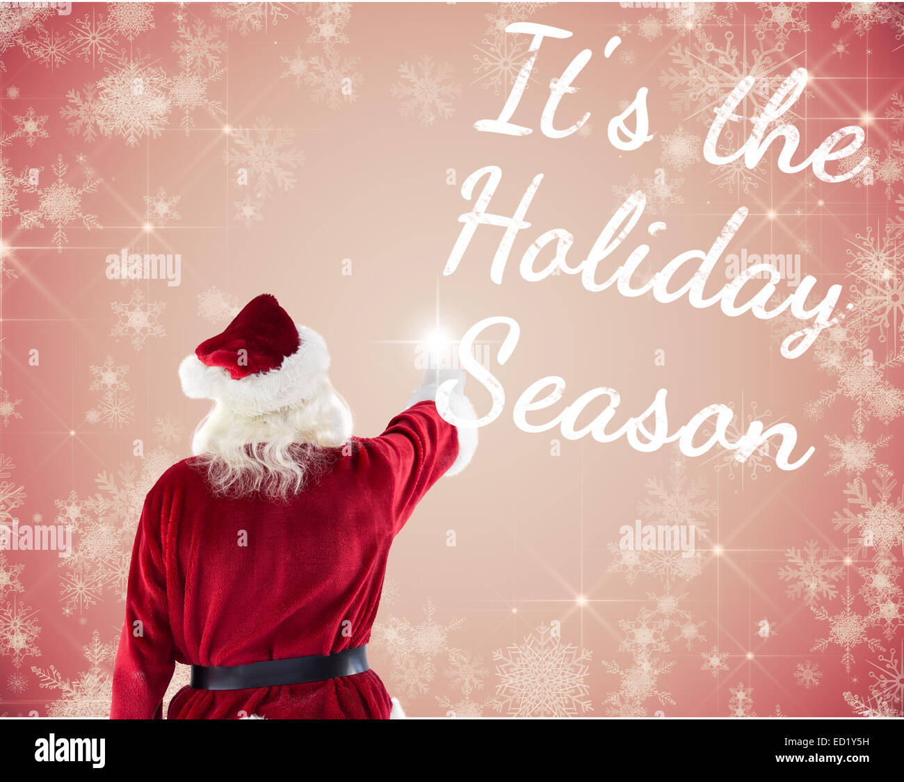 Composite image of santa claus points at something Stock Photo - Alamy