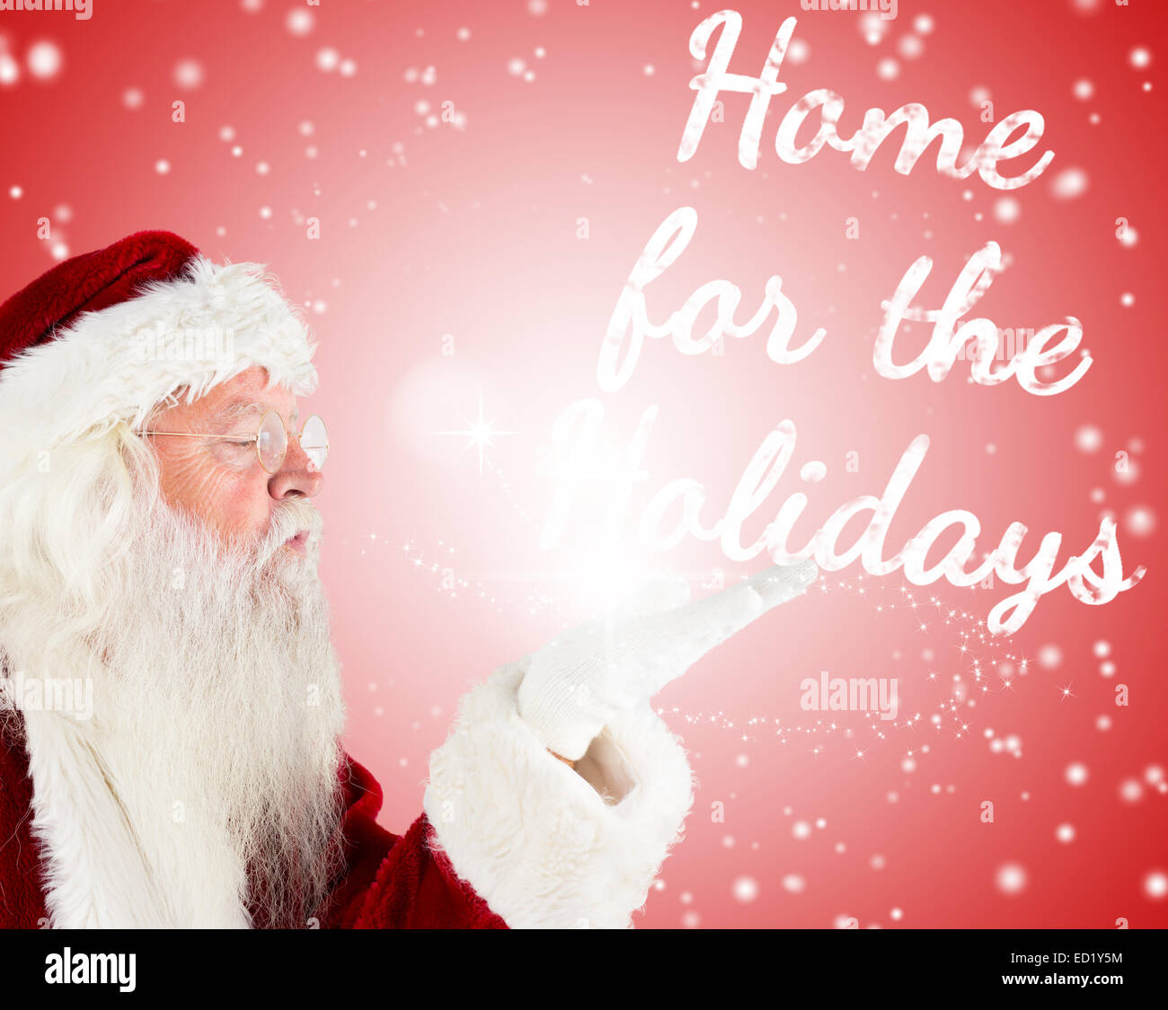 Composite image of santa claus blowing Stock Photo - Alamy