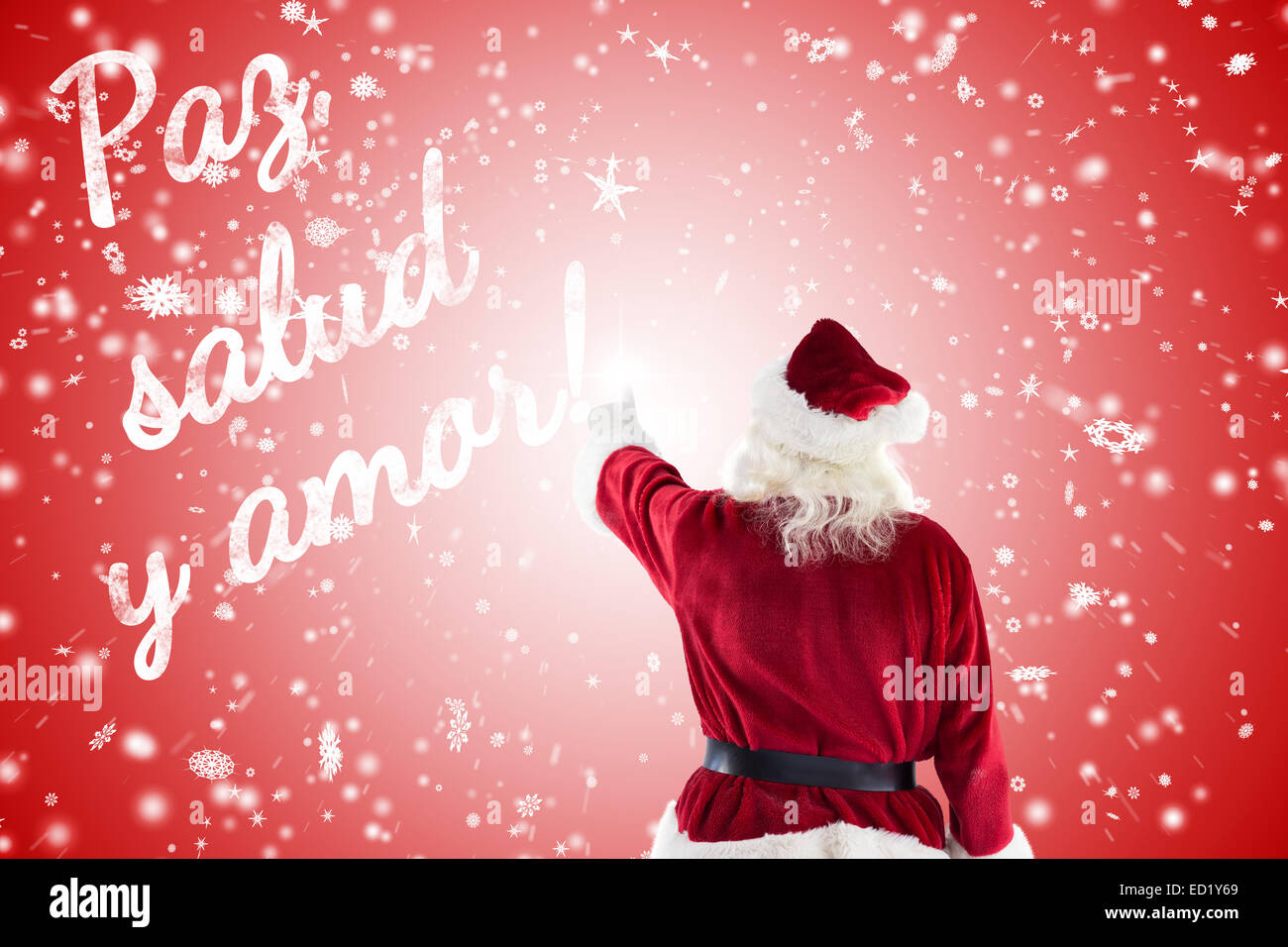 Composite image of santa claus points at something Stock Photo - Alamy