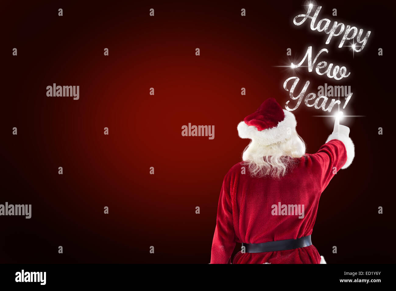 Composite image of santa claus points at something Stock Photo - Alamy