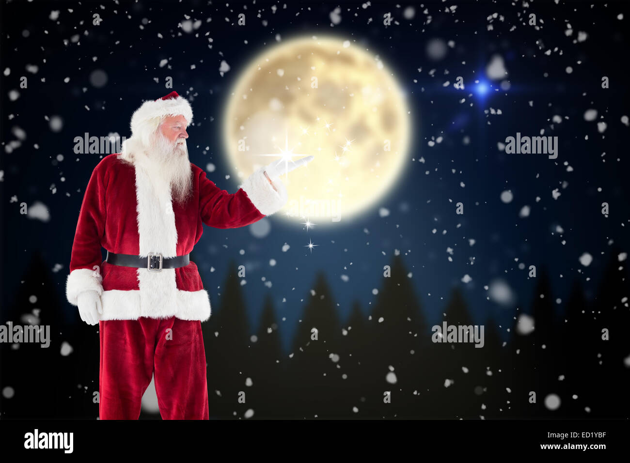 Composite image of santa shows something to camera Stock Photo - Alamy