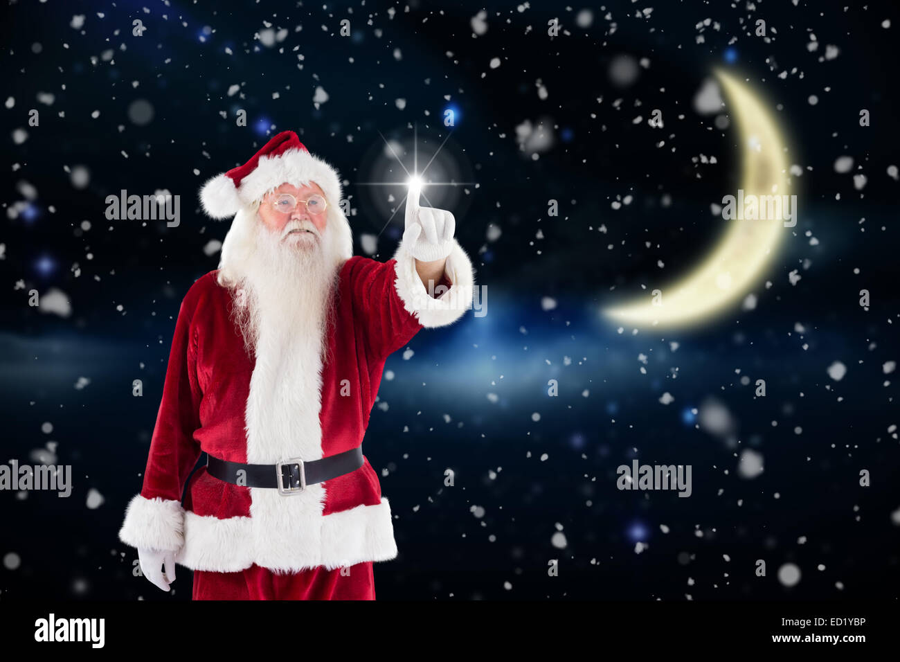 Composite image of santa claus points at something Stock Photo - Alamy
