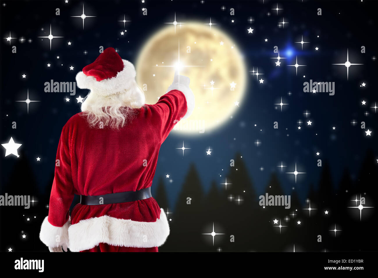Composite image of santa claus points at something Stock Photo - Alamy