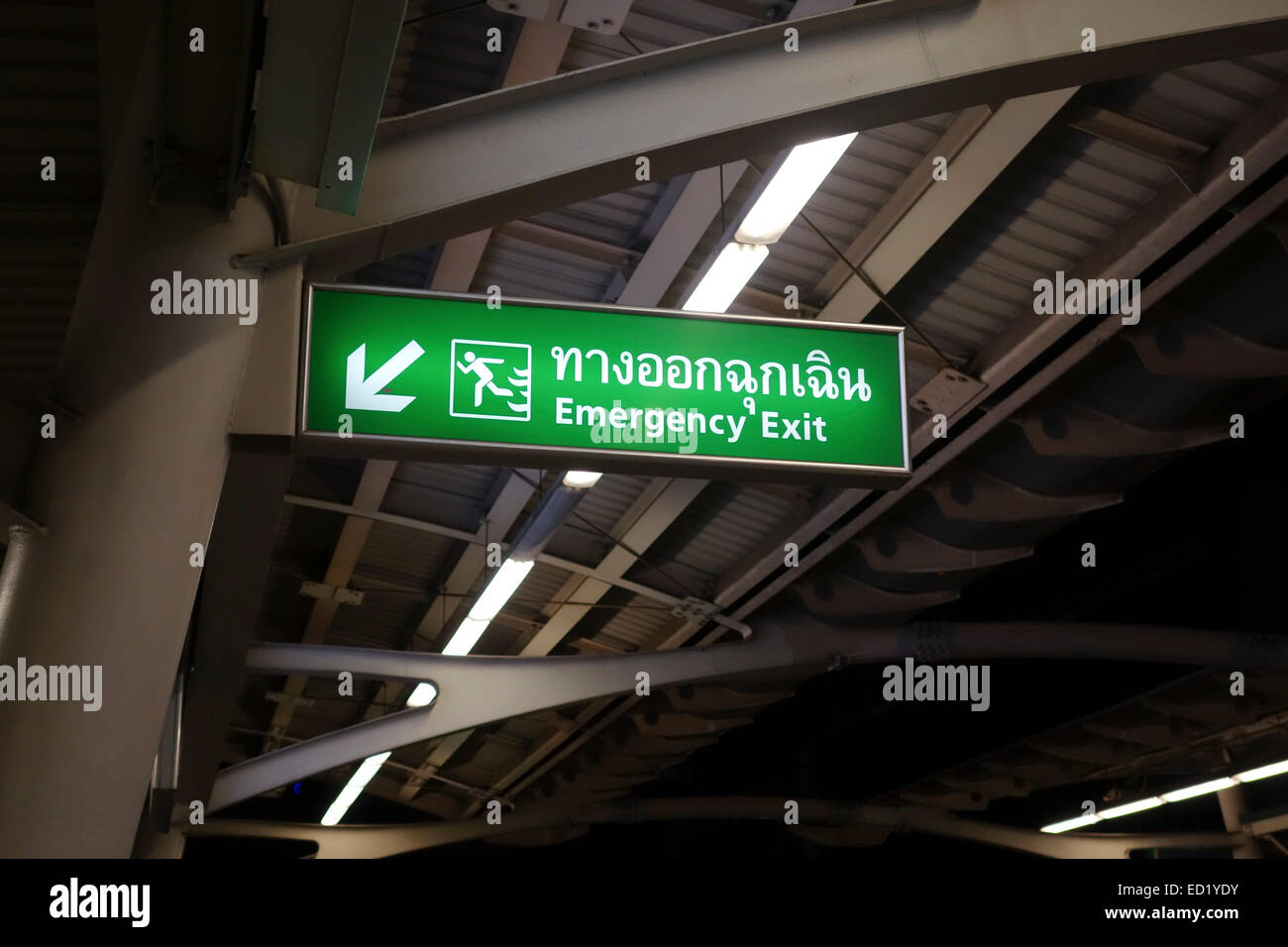 Emergency exit sign at skytrain station, Thai language, Bangkok ...