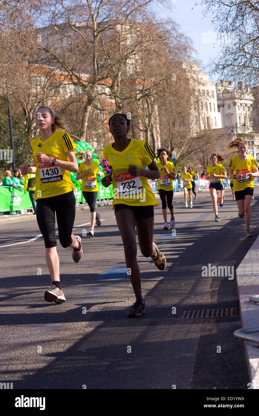 LONDON - APRIL 13: Unidentified girls run the London marathon on April ...