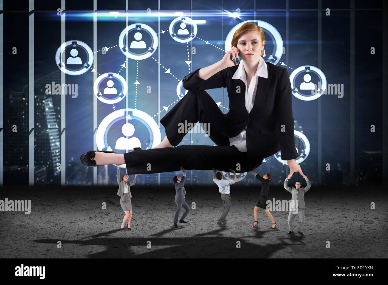 Composite image of business people supporting boss Stock Photo - Alamy