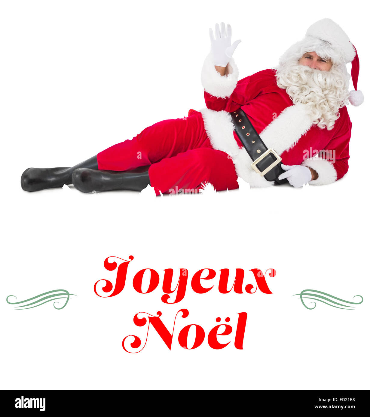 Composite image of relaxed santa lying and waving Stock Photo - Alamy