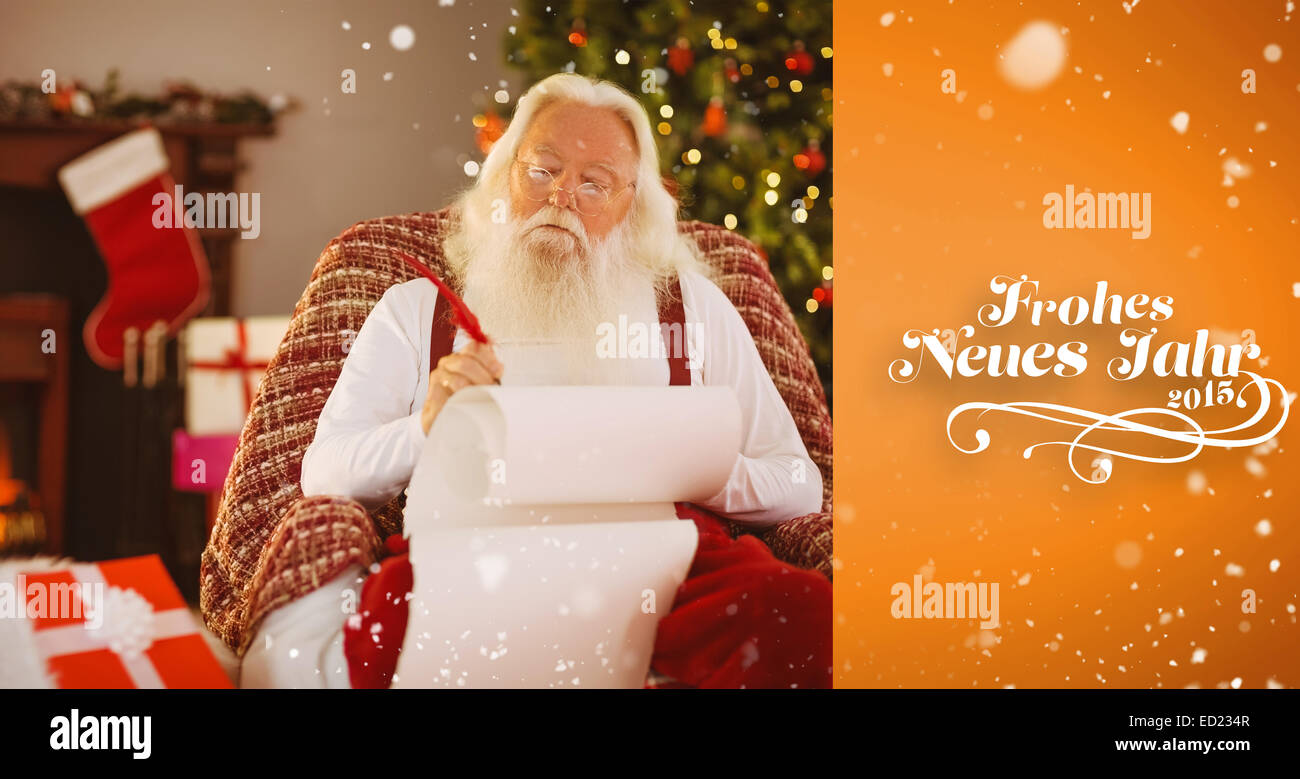 Composite image of relaxed santa writing list with a quill Stock Photo ...