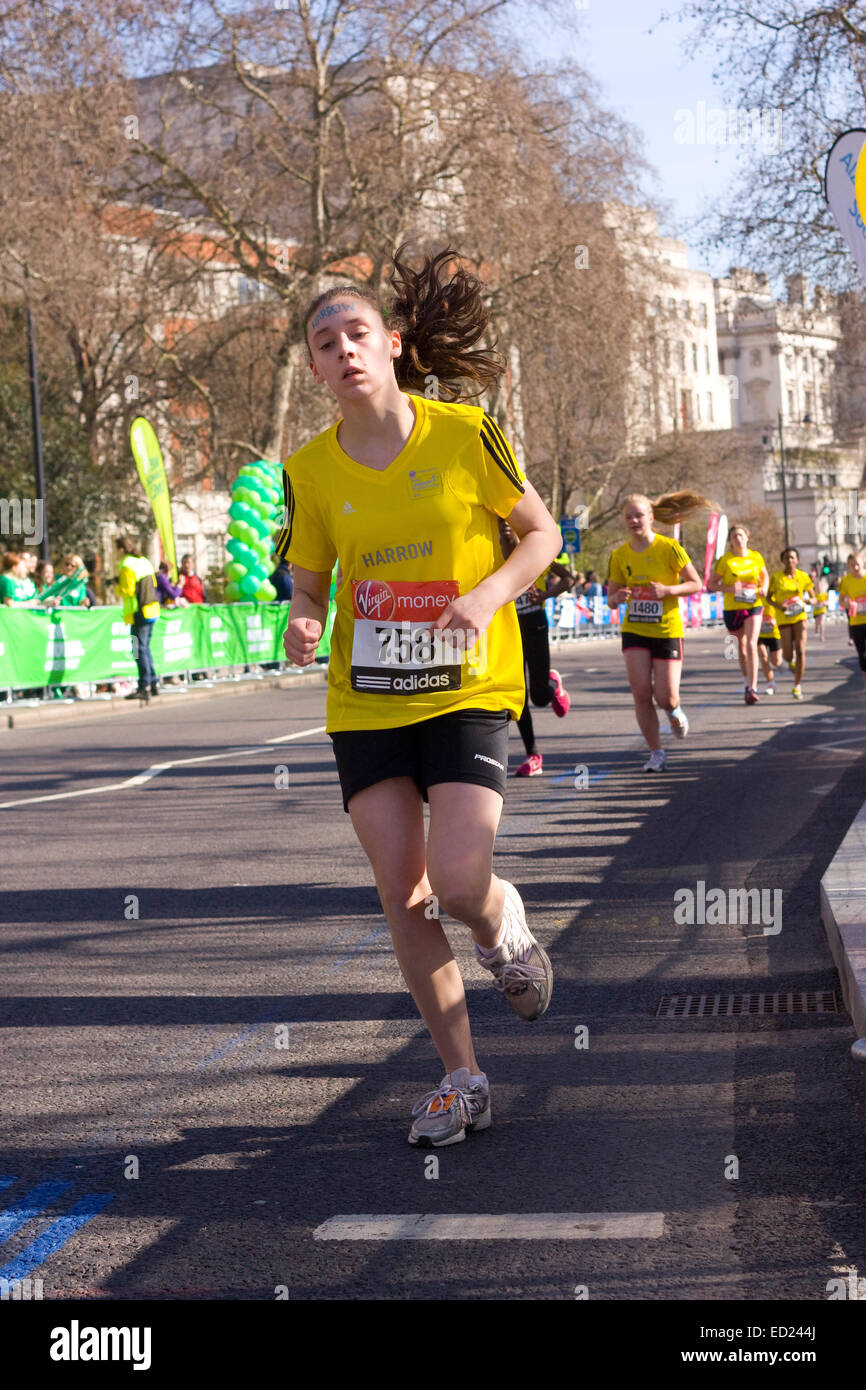 LONDON - APRIL 13: Unidentified girls run the London marathon on April ...