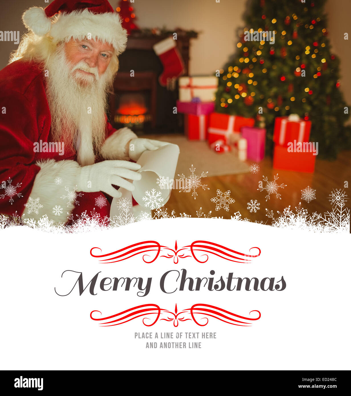 Composite image of smiling santa claus holding a scroll Stock Photo - Alamy