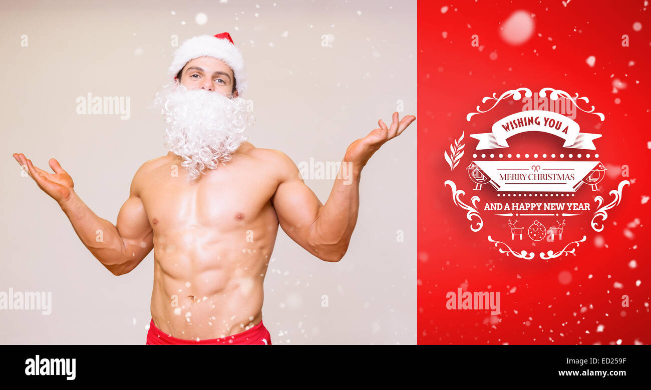 Composite image of portrait of shirtless macho man with fake santa ...