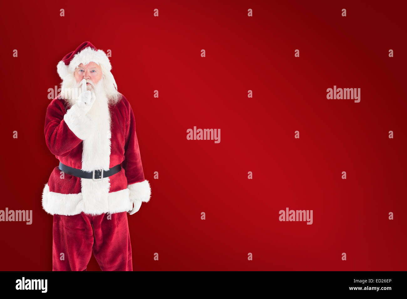 Composite image of santa asking for quiet to camera Stock Photo - Alamy