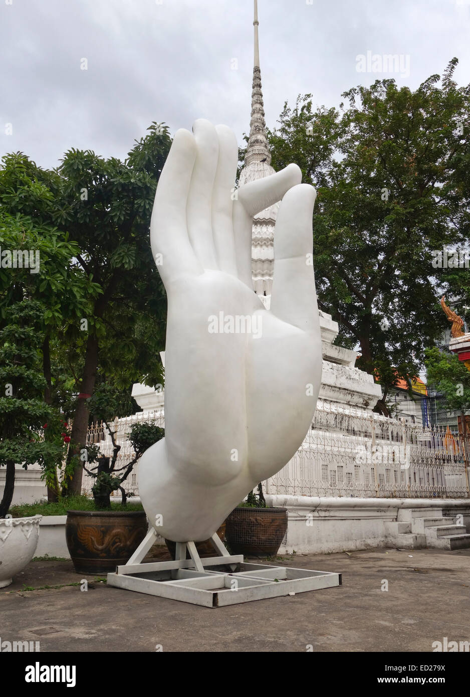 Big buddhist hand statue in Buddhist temple, symbolising the wheel of ...