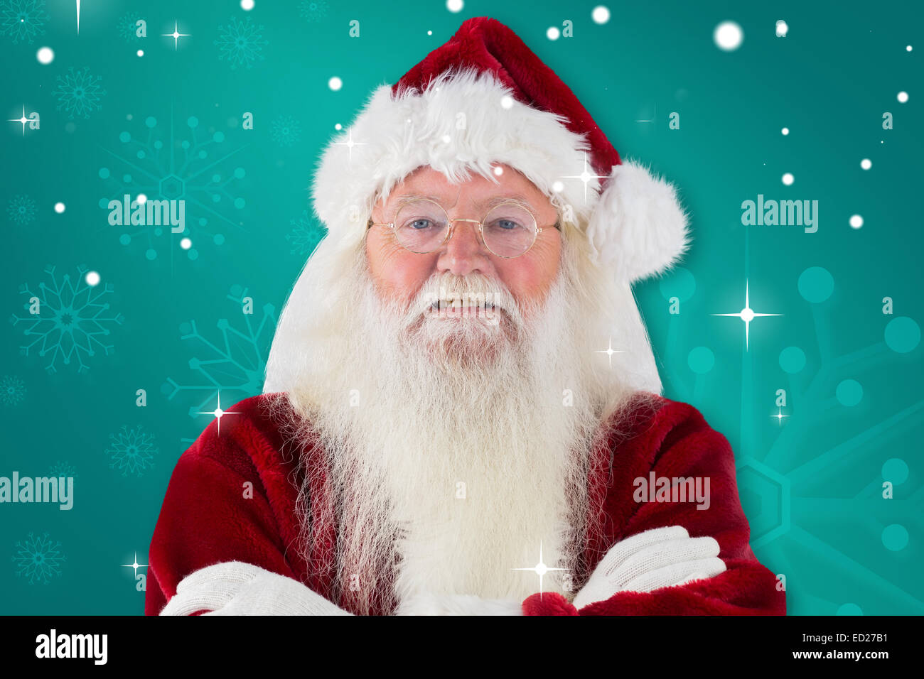 Composite image of santa smiles with folded arms Stock Photo - Alamy