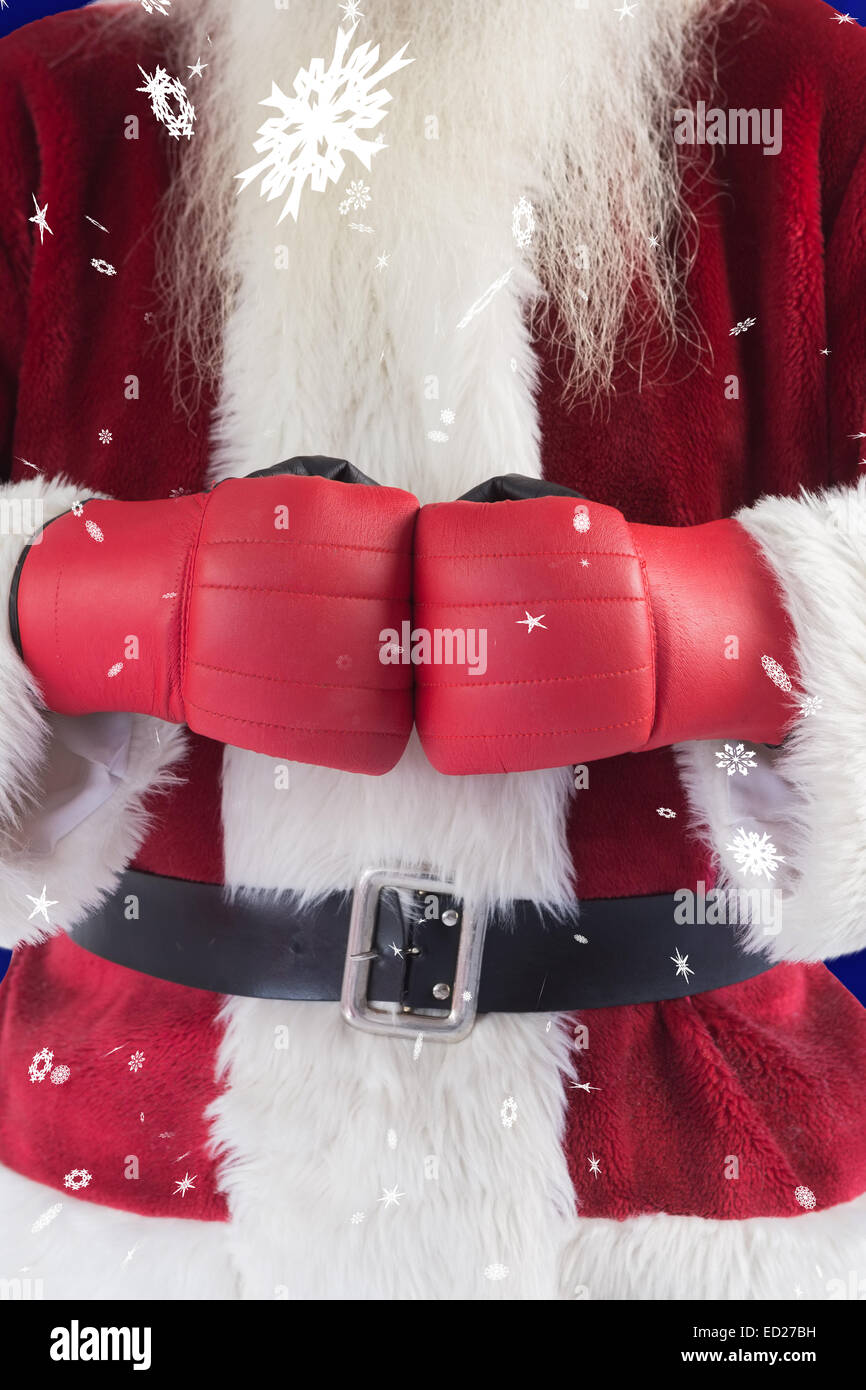 Composite image of santa claus wears boxing gloves Stock Photo - Alamy